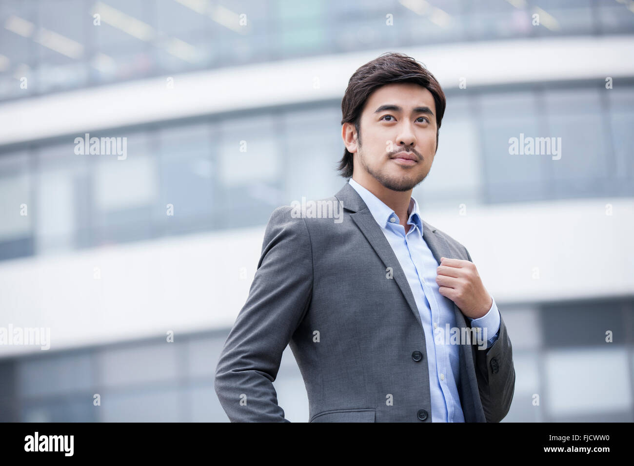 Confident Chinese businessman Stock Photo - Alamy