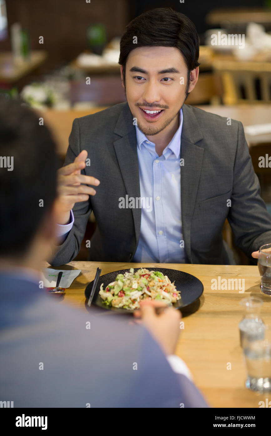 Chinese businessmen having dinner together Stock Photo - Alamy