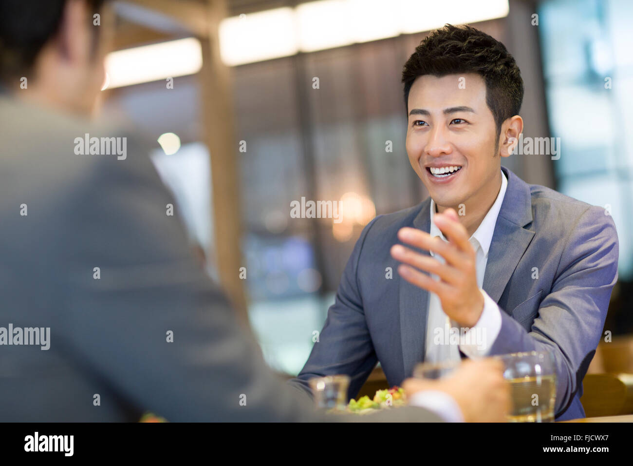 Chinese businessmen having dinner together Stock Photo - Alamy
