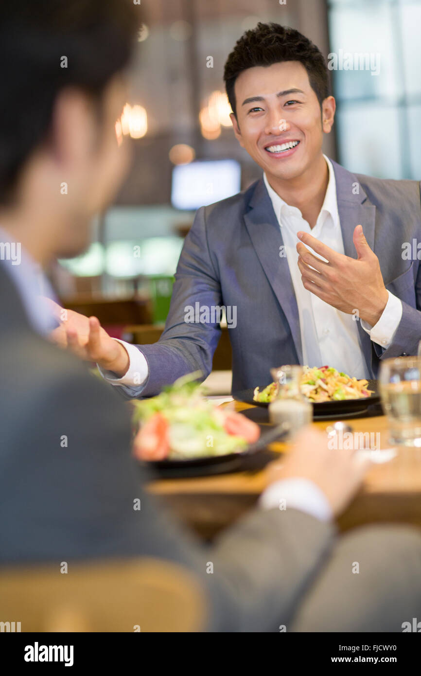 Chinese businessmen having dinner together Stock Photo - Alamy