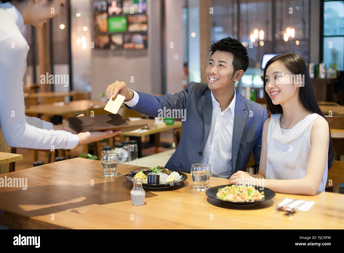 Paying meals hi-res stock photography and images - Alamy