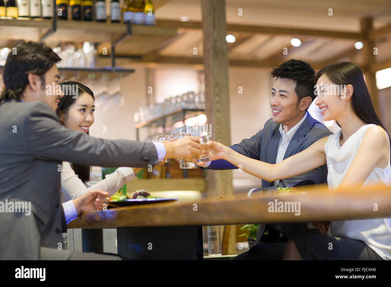 Four friends having dinner top hi-res stock photography and images - Alamy