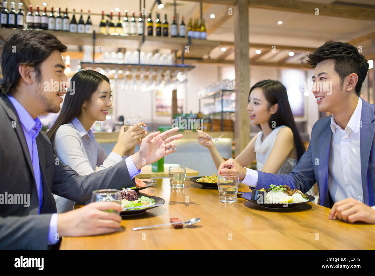 Chinese friends having dinner together Stock Photo - Alamy