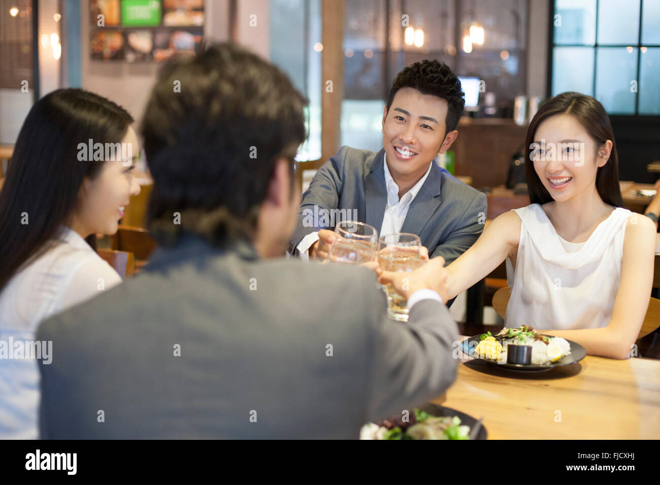 Chinese friends having dinner together Stock Photo - Alamy