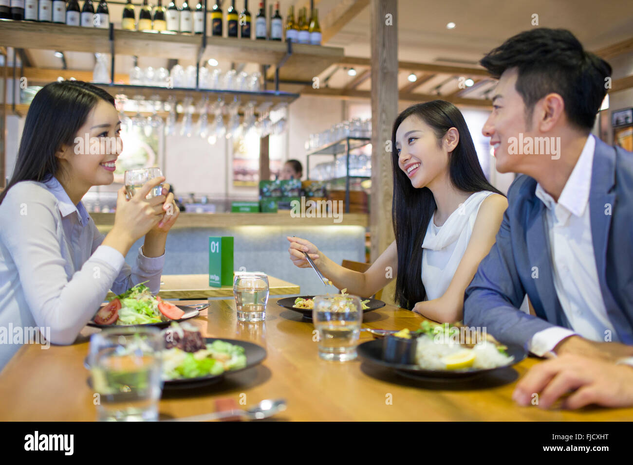 Chinese friends having dinner together Stock Photo - Alamy