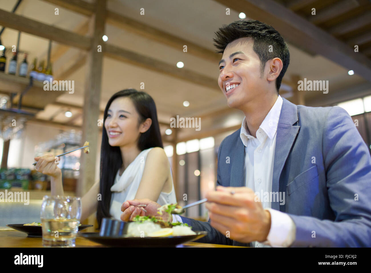 Young Chinese couple having dinner together Stock Photo - Alamy