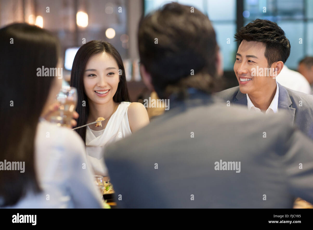 Chinese friends having dinner together Stock Photo - Alamy