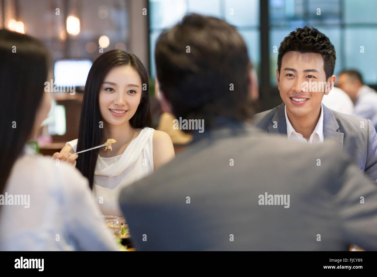 Chinese friends having dinner together Stock Photo - Alamy