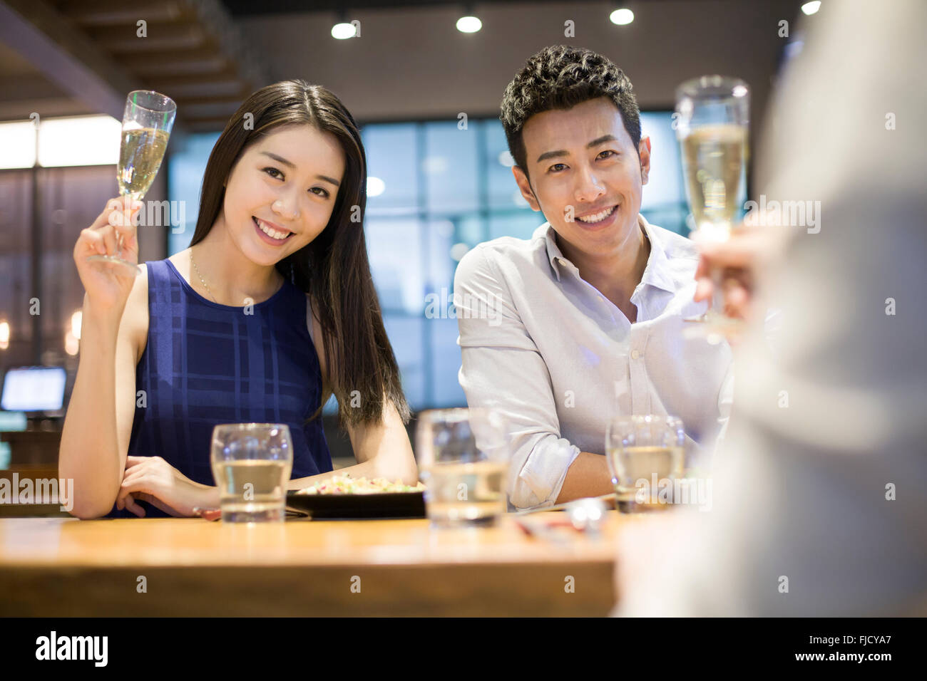 Chinese friends having dinner together Stock Photo - Alamy