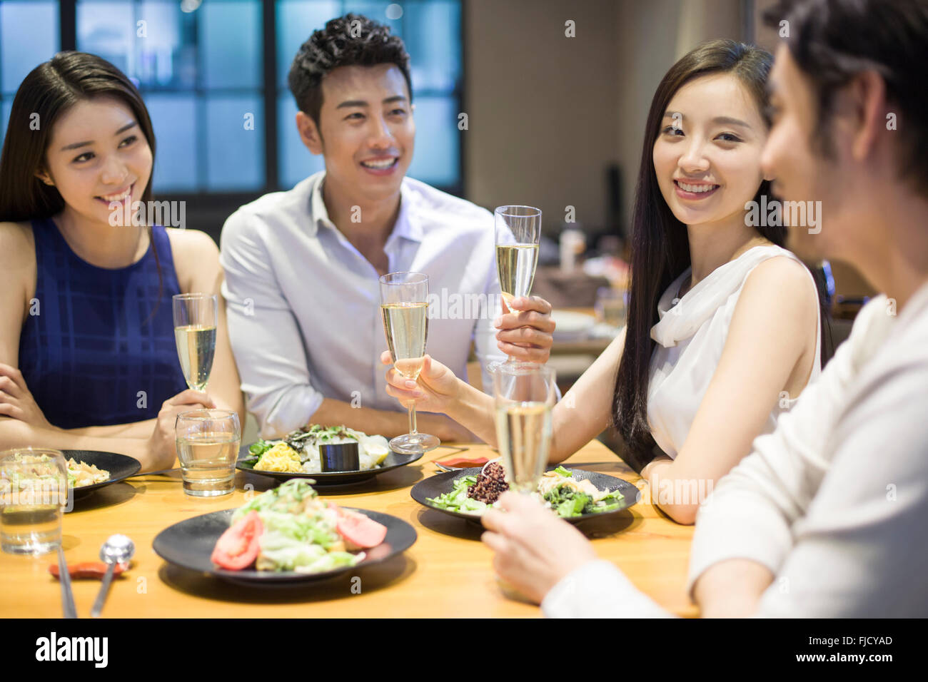 Chinese friends having dinner together Stock Photo - Alamy
