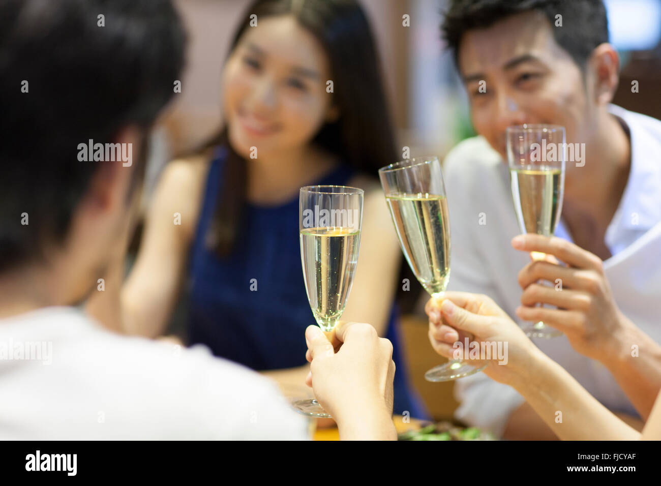 Chinese friends having dinner together Stock Photo - Alamy