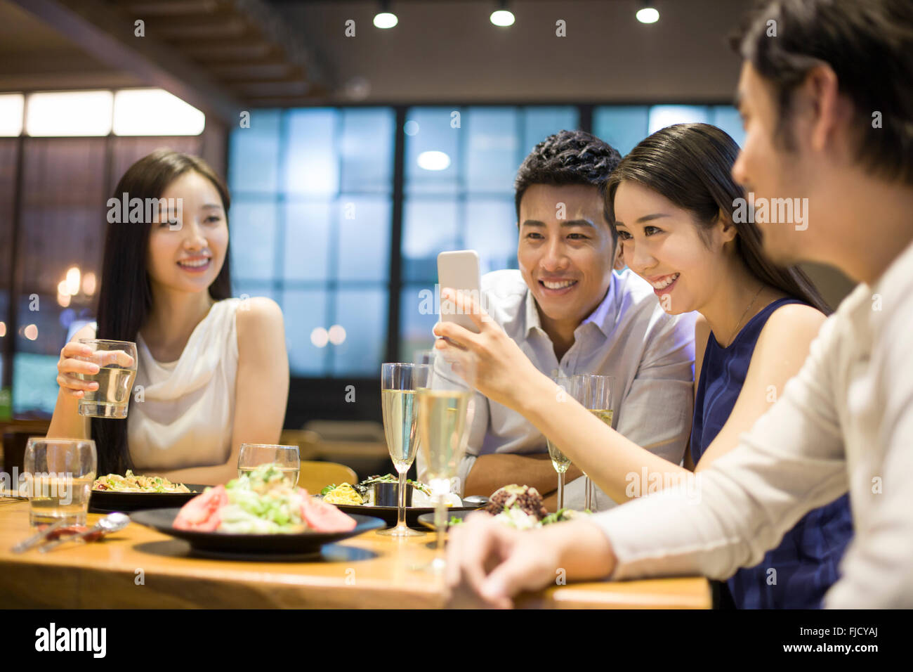 Chinese friends having dinner together Stock Photo - Alamy