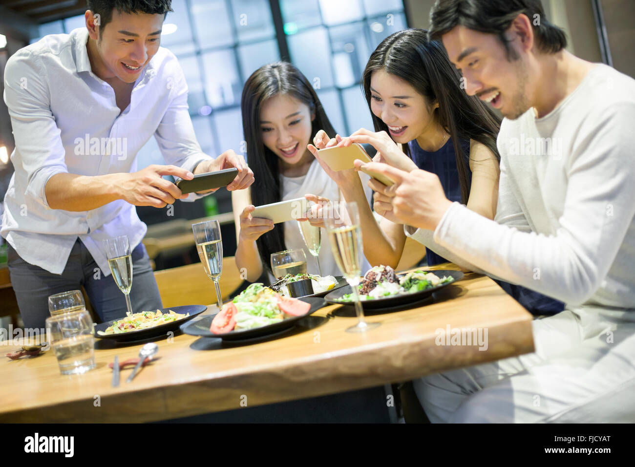 Chinese friends having dinner together Stock Photo - Alamy