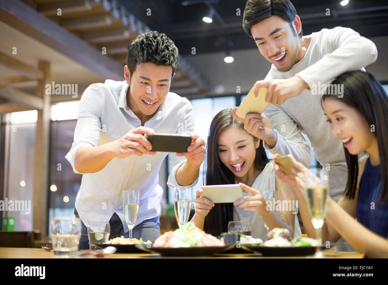 Chinese friends having dinner together Stock Photo - Alamy