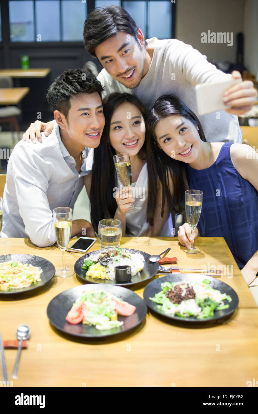 Chinese friends having dinner together Stock Photo - Alamy