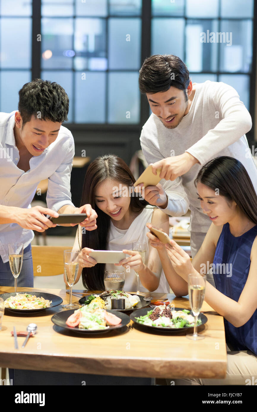 Four friends having dinner top hi-res stock photography and images - Alamy