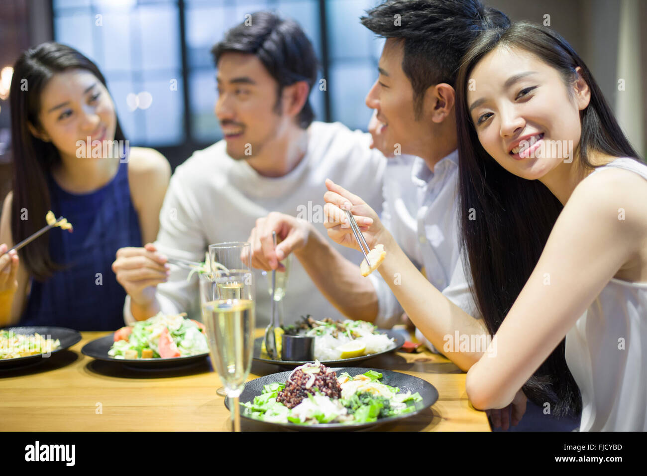 Chinese friends having dinner together Stock Photo - Alamy