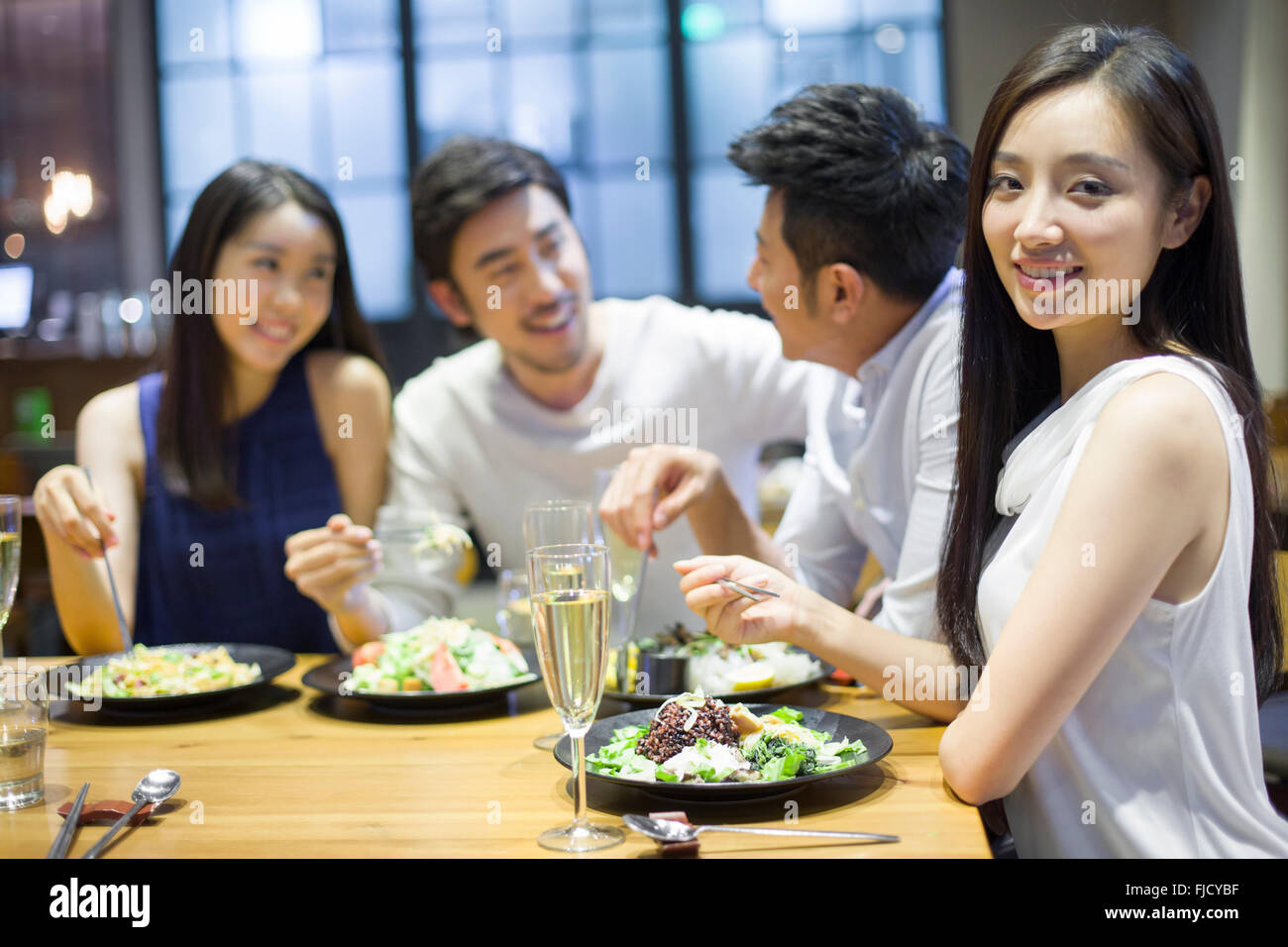 Chinese friends having dinner together Stock Photo - Alamy