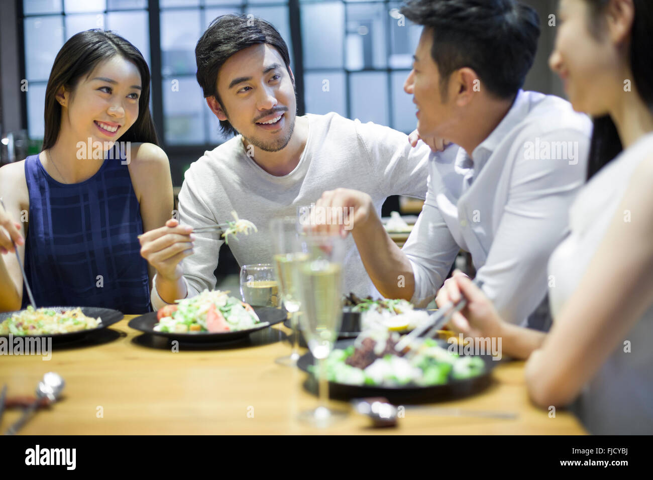Four friends having dinner top hi-res stock photography and images - Alamy