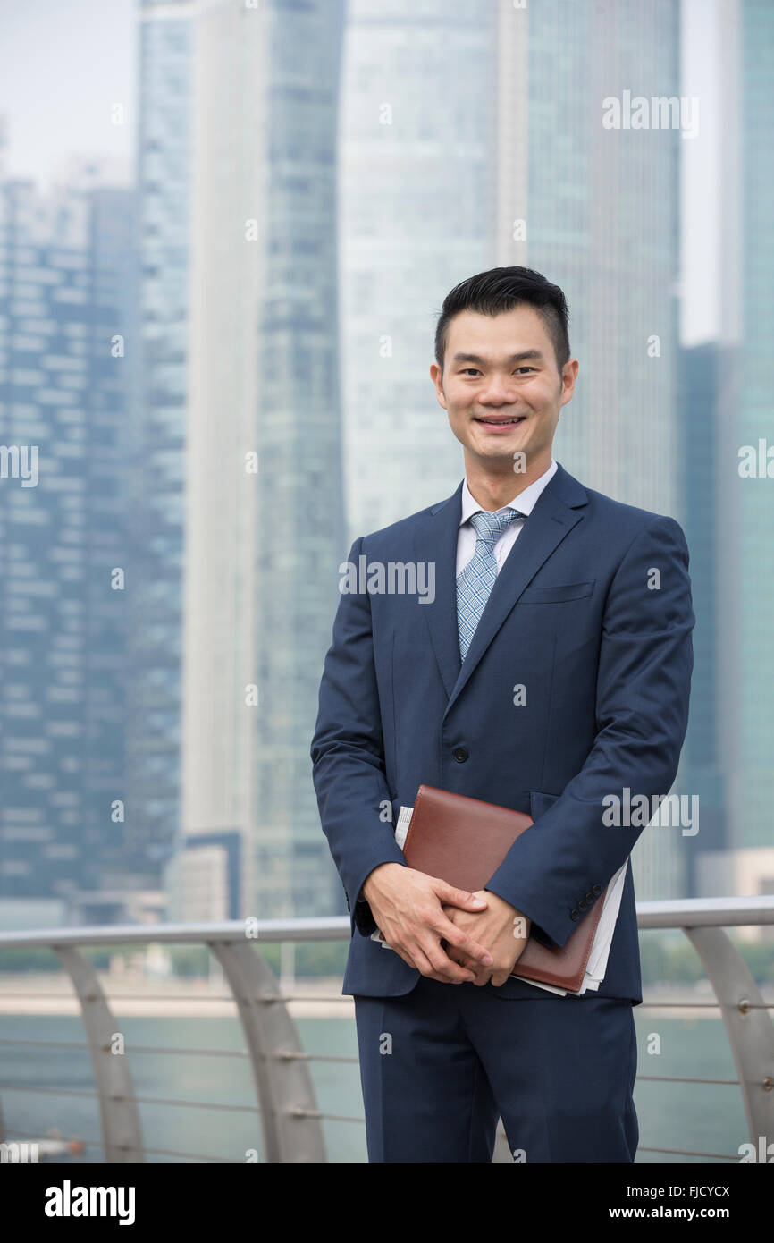 A happy looking Asian businessman Stock Photo - Alamy