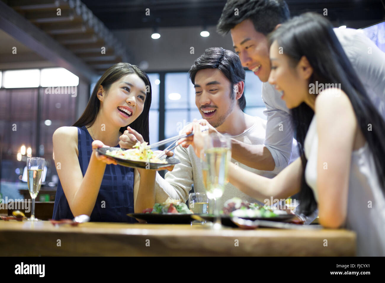 Four friends having dinner top hi-res stock photography and images - Alamy