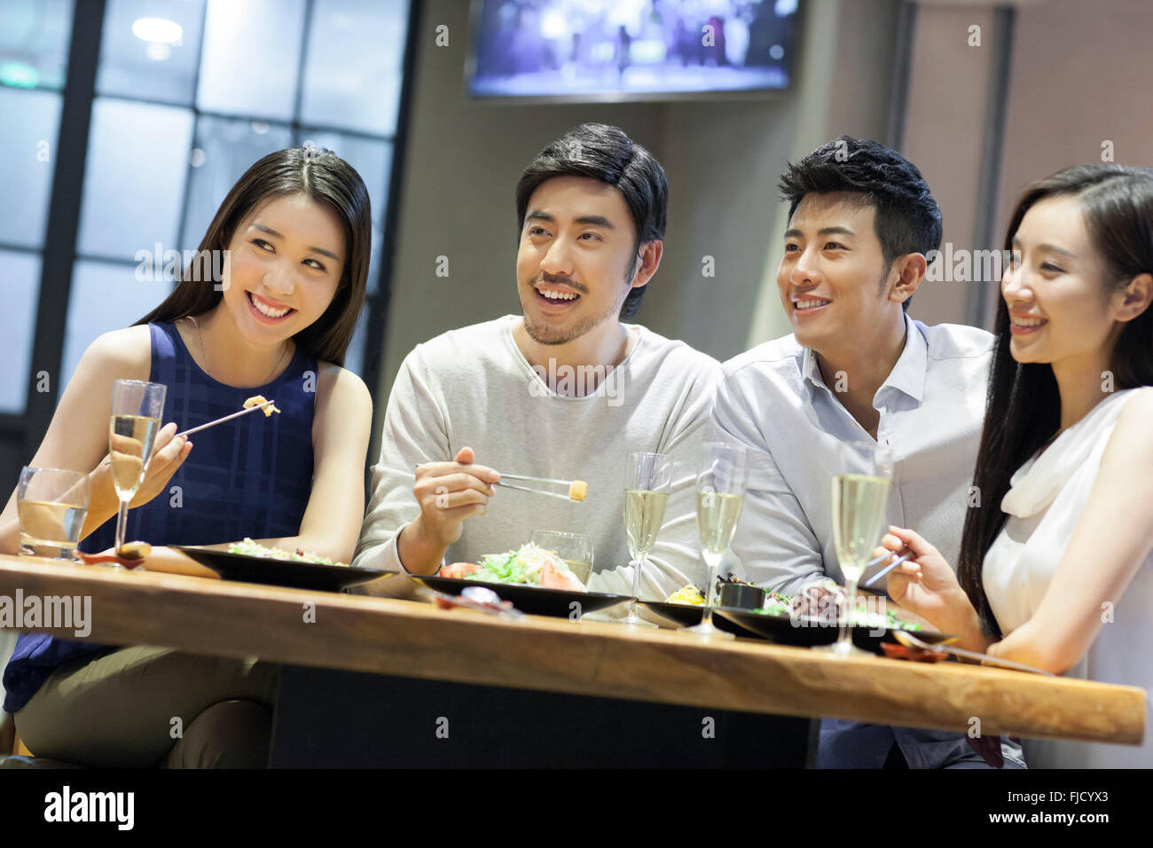 Four friends having dinner top hi-res stock photography and images - Alamy