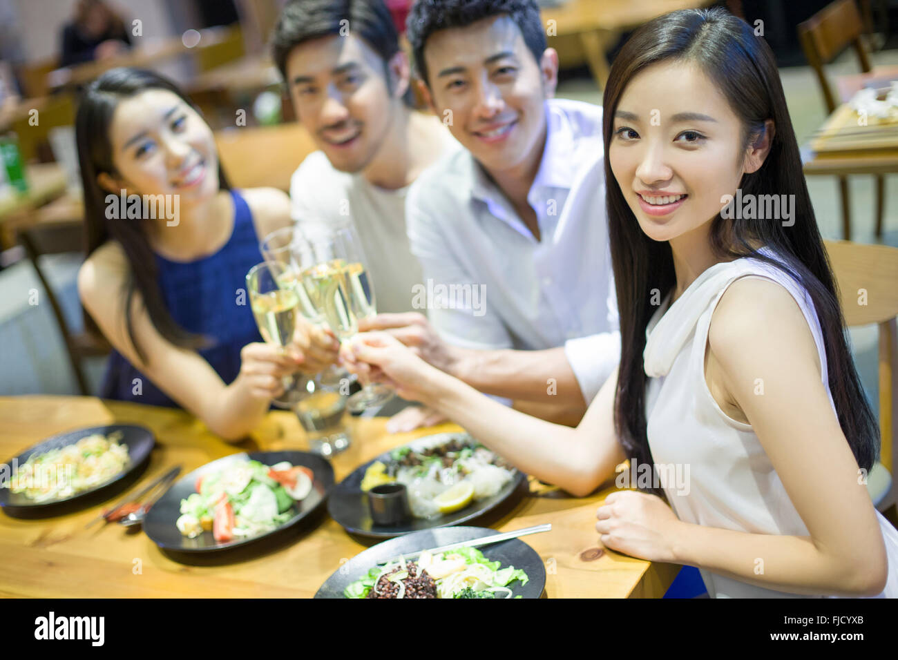 Four friends having dinner top hi-res stock photography and images - Alamy