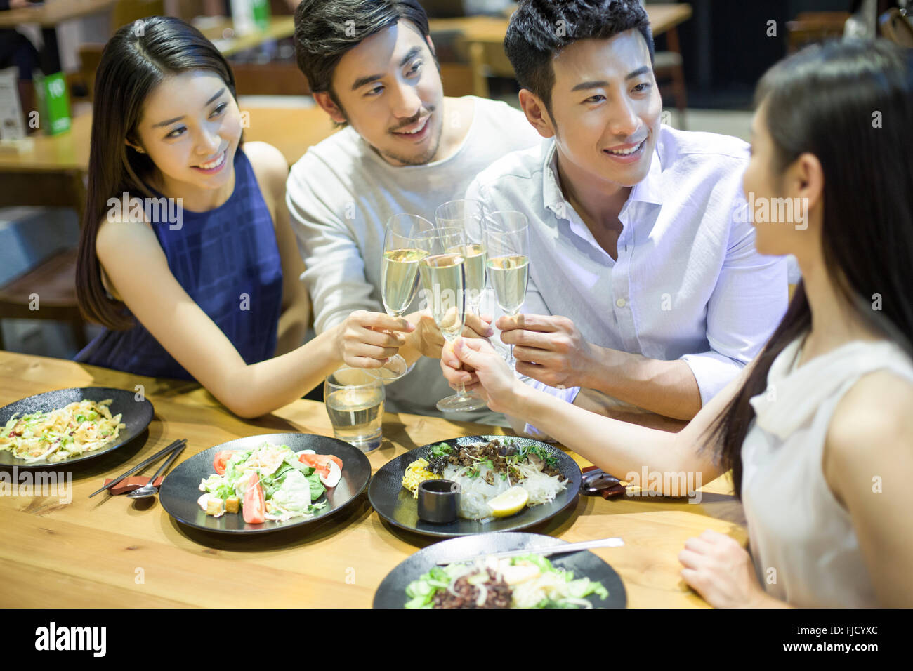 Chinese friends having dinner together Stock Photo - Alamy