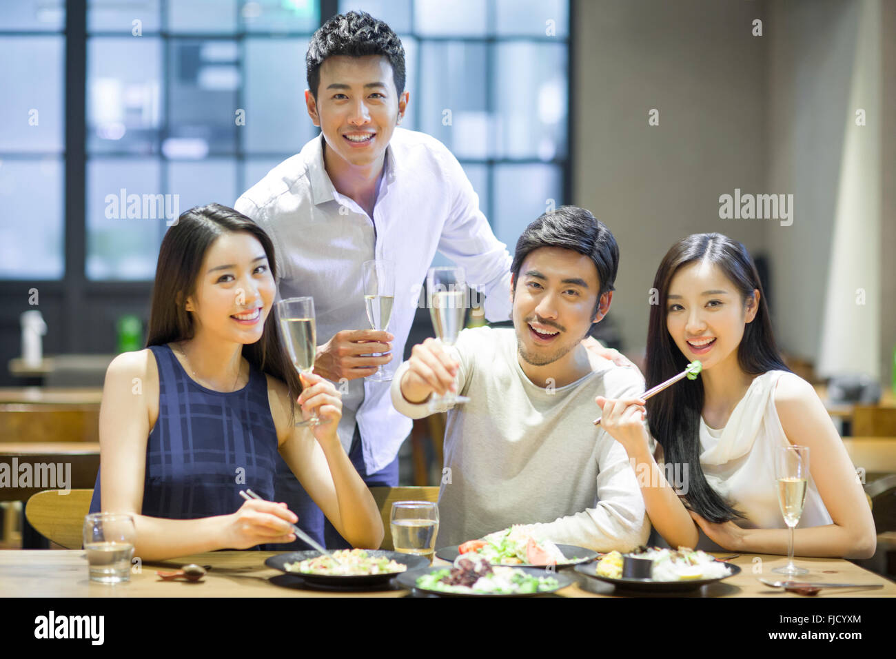 Chinese friends having dinner together Stock Photo - Alamy