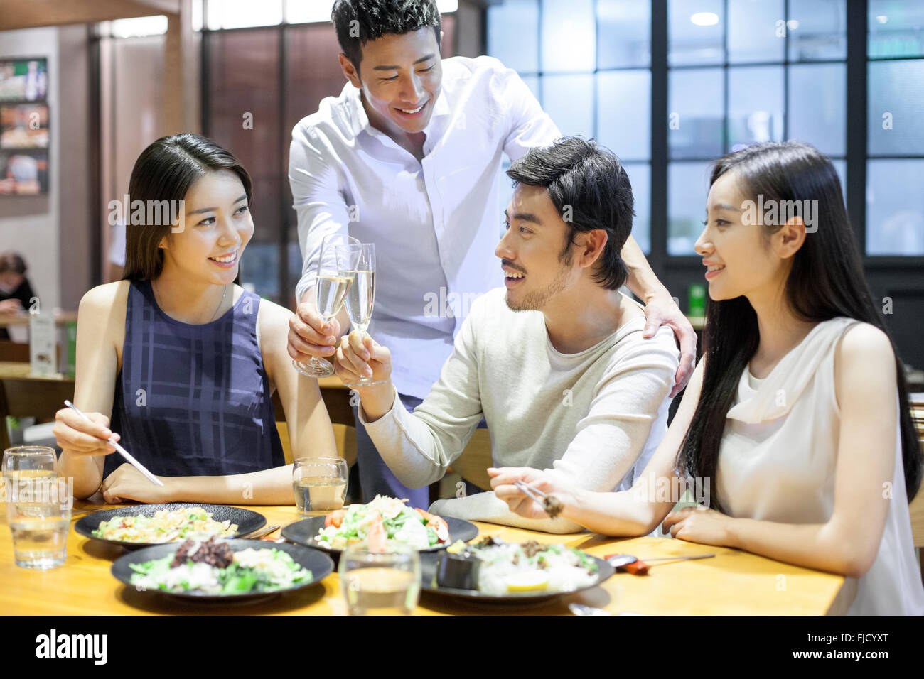 Chinese friends having dinner together Stock Photo - Alamy