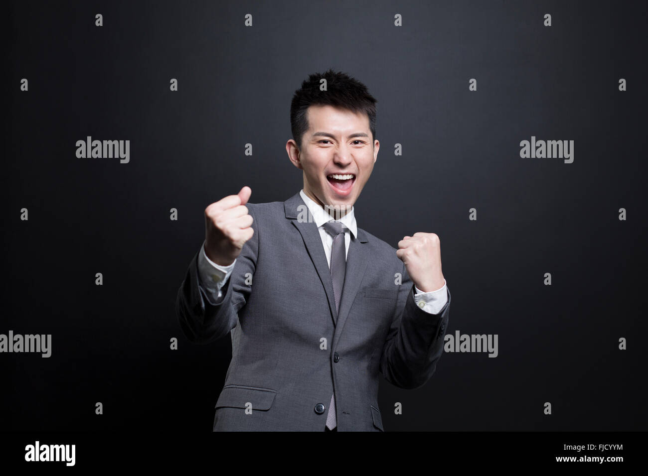 Excited Chinese businessman Stock Photo - Alamy