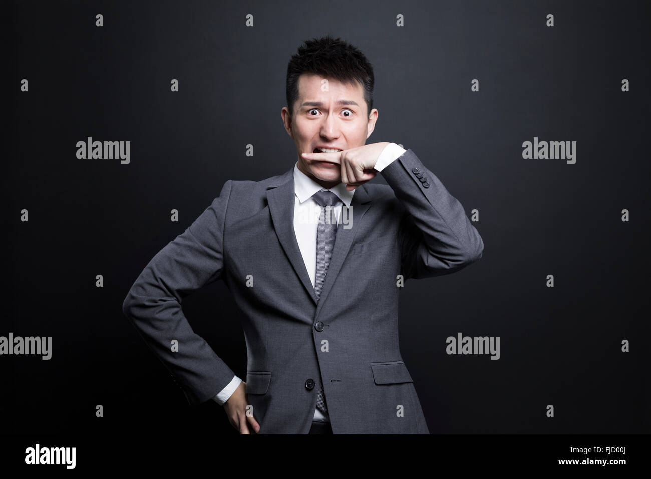 Scared Chinese businessman Stock Photo - Alamy