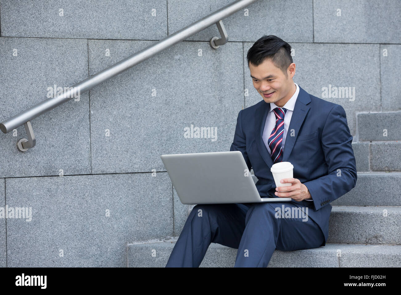 Asian business man laptop hi-res stock photography and images - Alamy