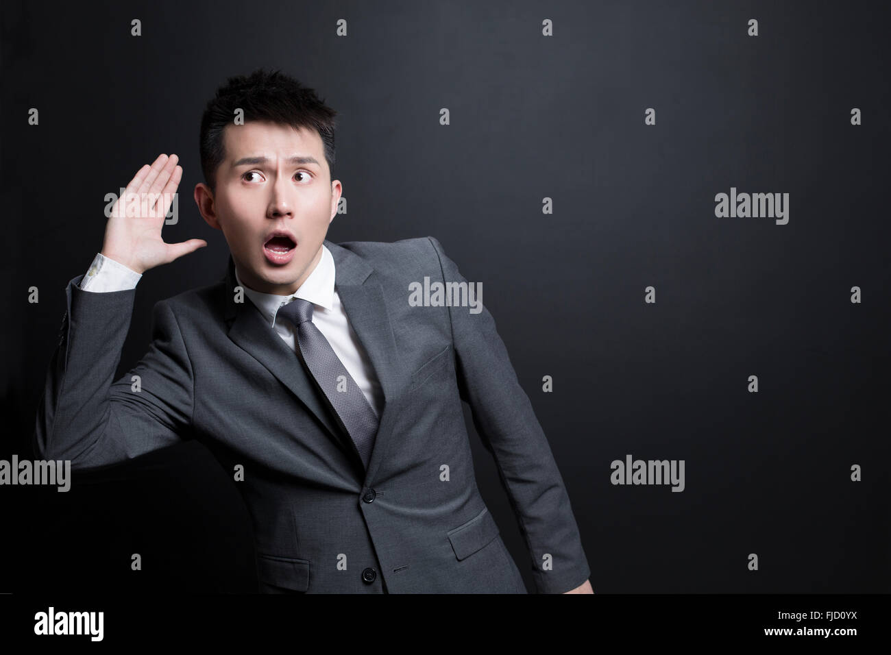Chinese businessman eavesdropping Stock Photo - Alamy