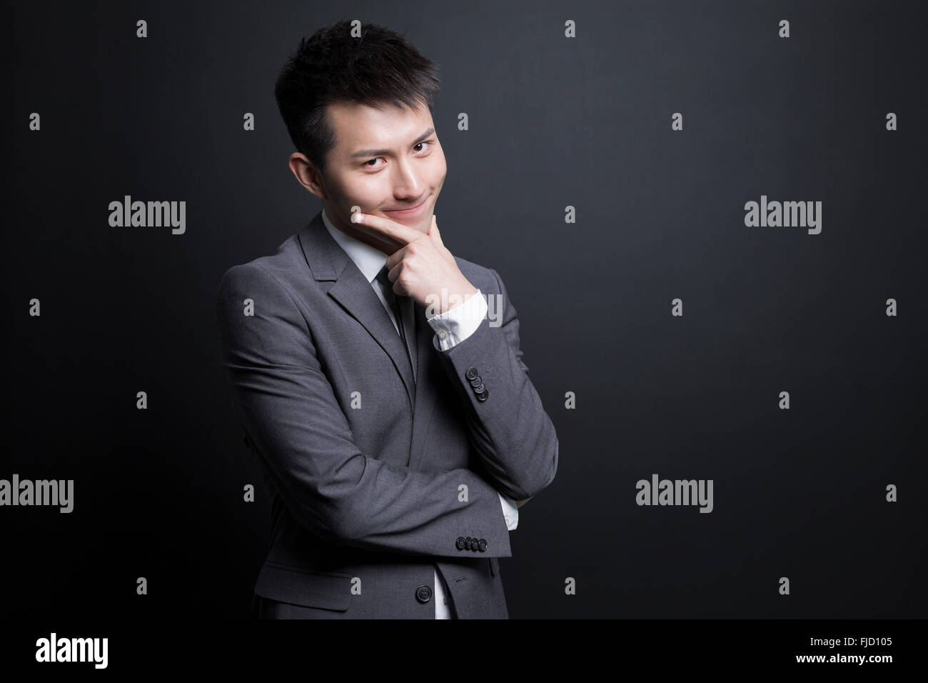 Portrait of young Chinese businessman Stock Photo - Alamy