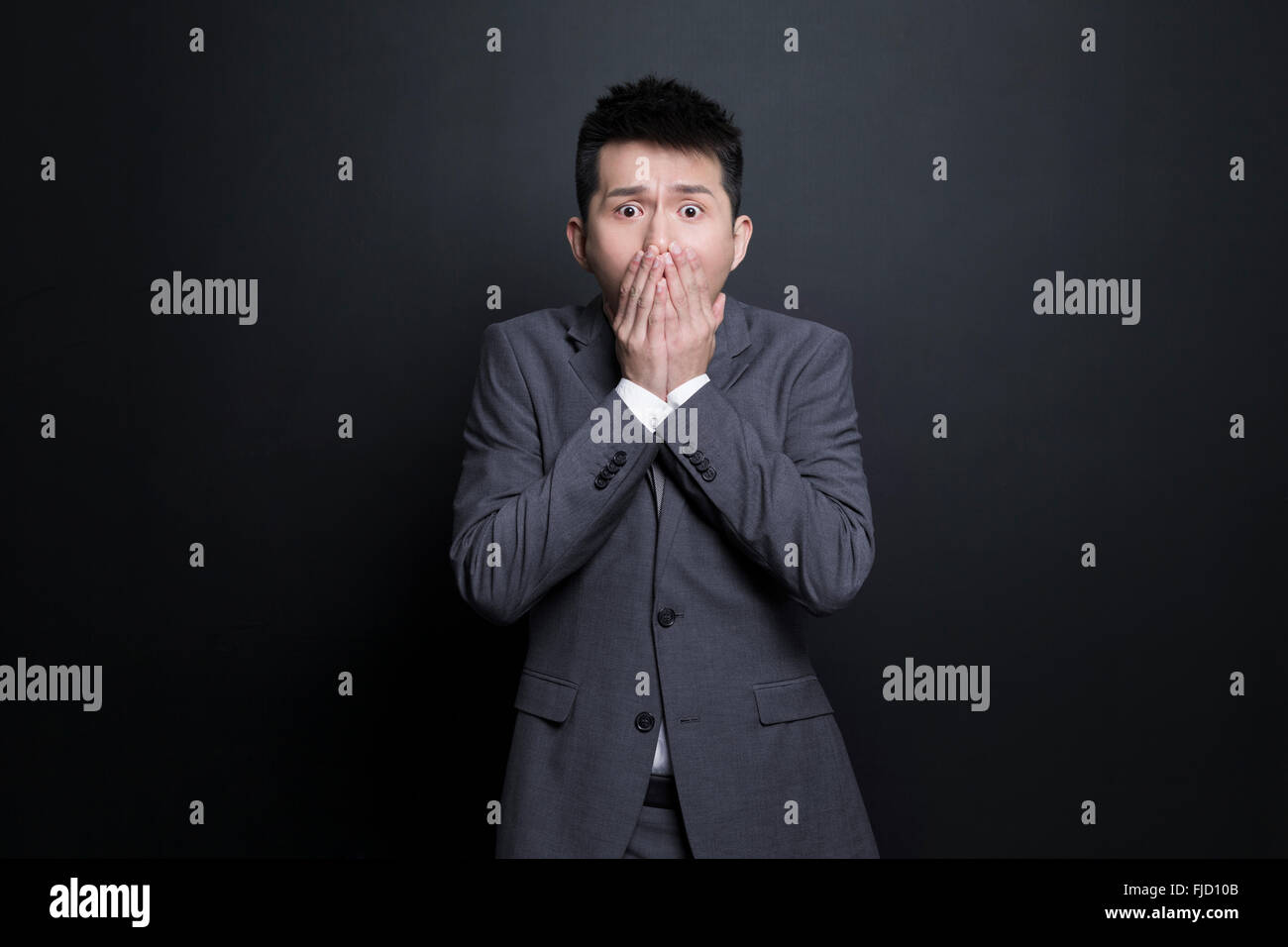 Scared Chinese businessman Stock Photo - Alamy