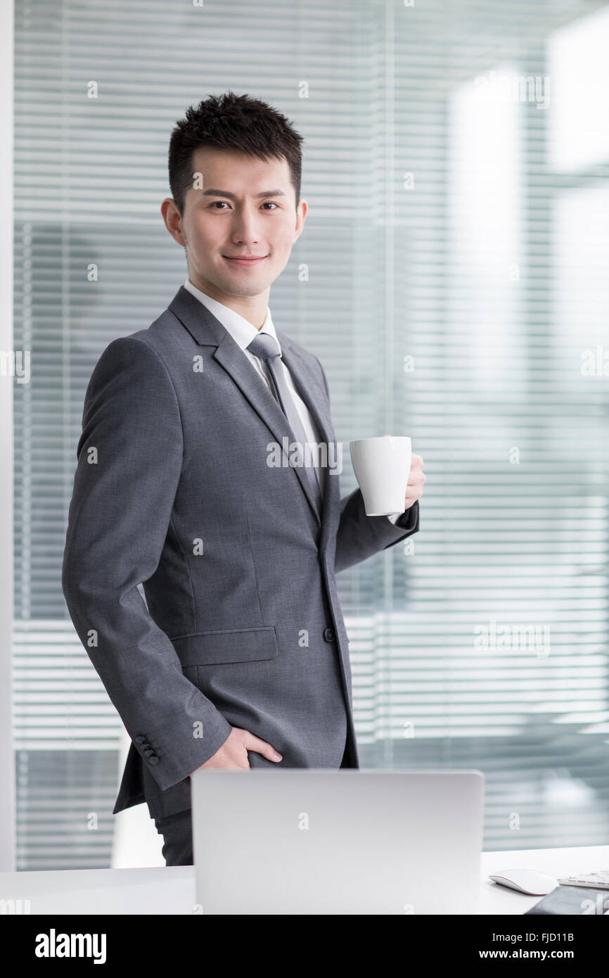 Chinese businessman taking a coffee break Stock Photo - Alamy
