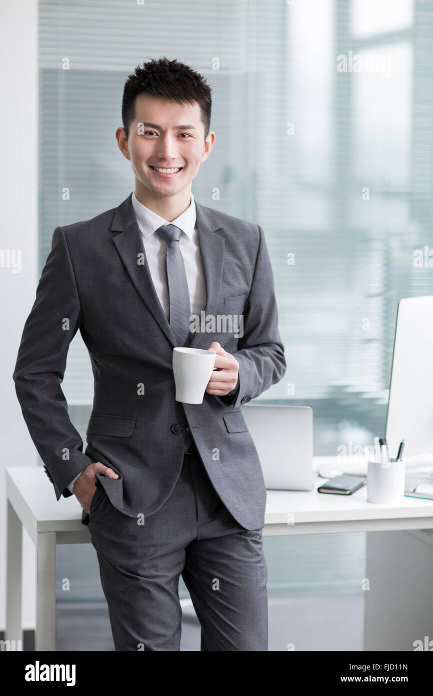 Chinese businessman taking a coffee break Stock Photo - Alamy