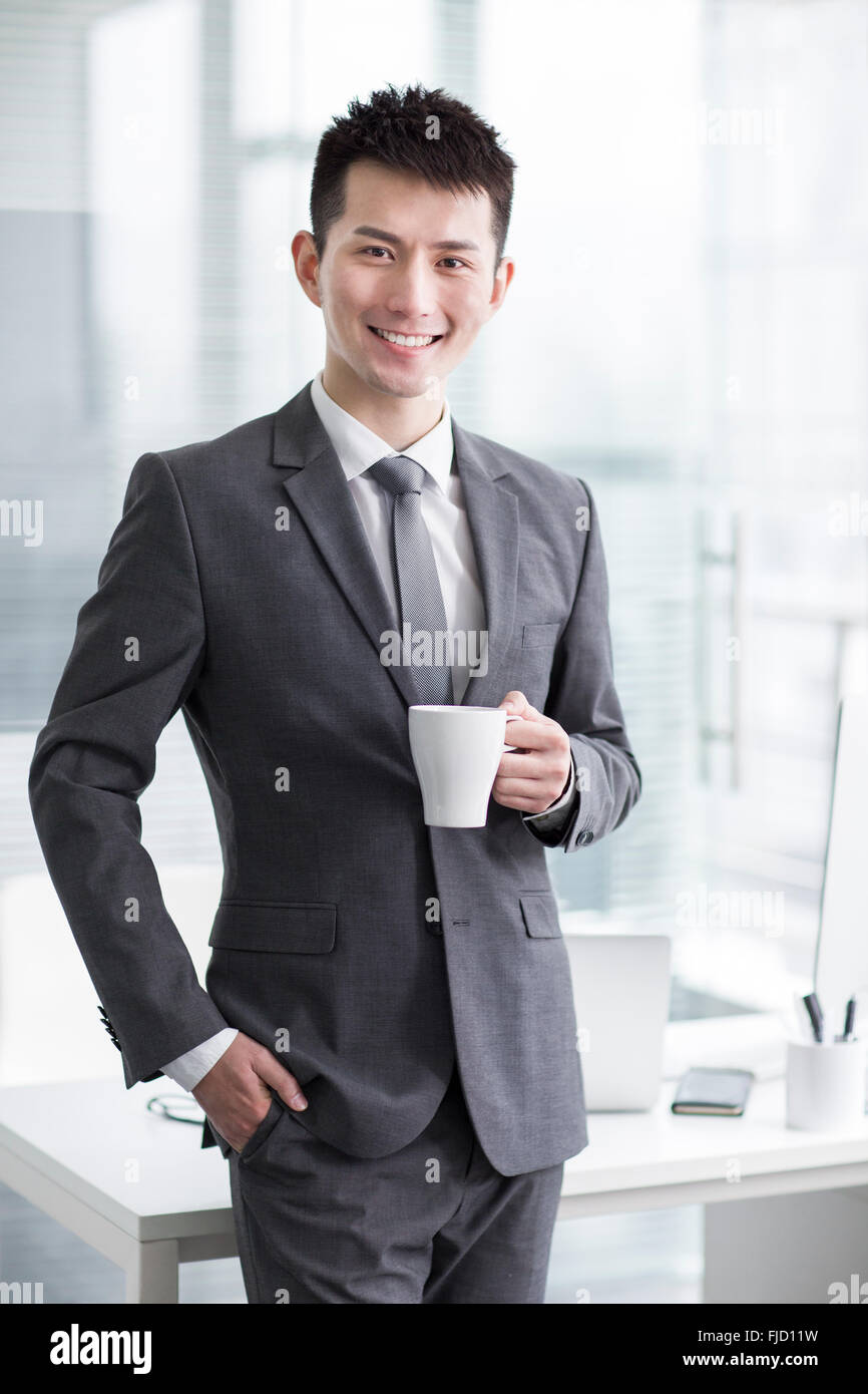Chinese businessman taking a coffee break Stock Photo - Alamy