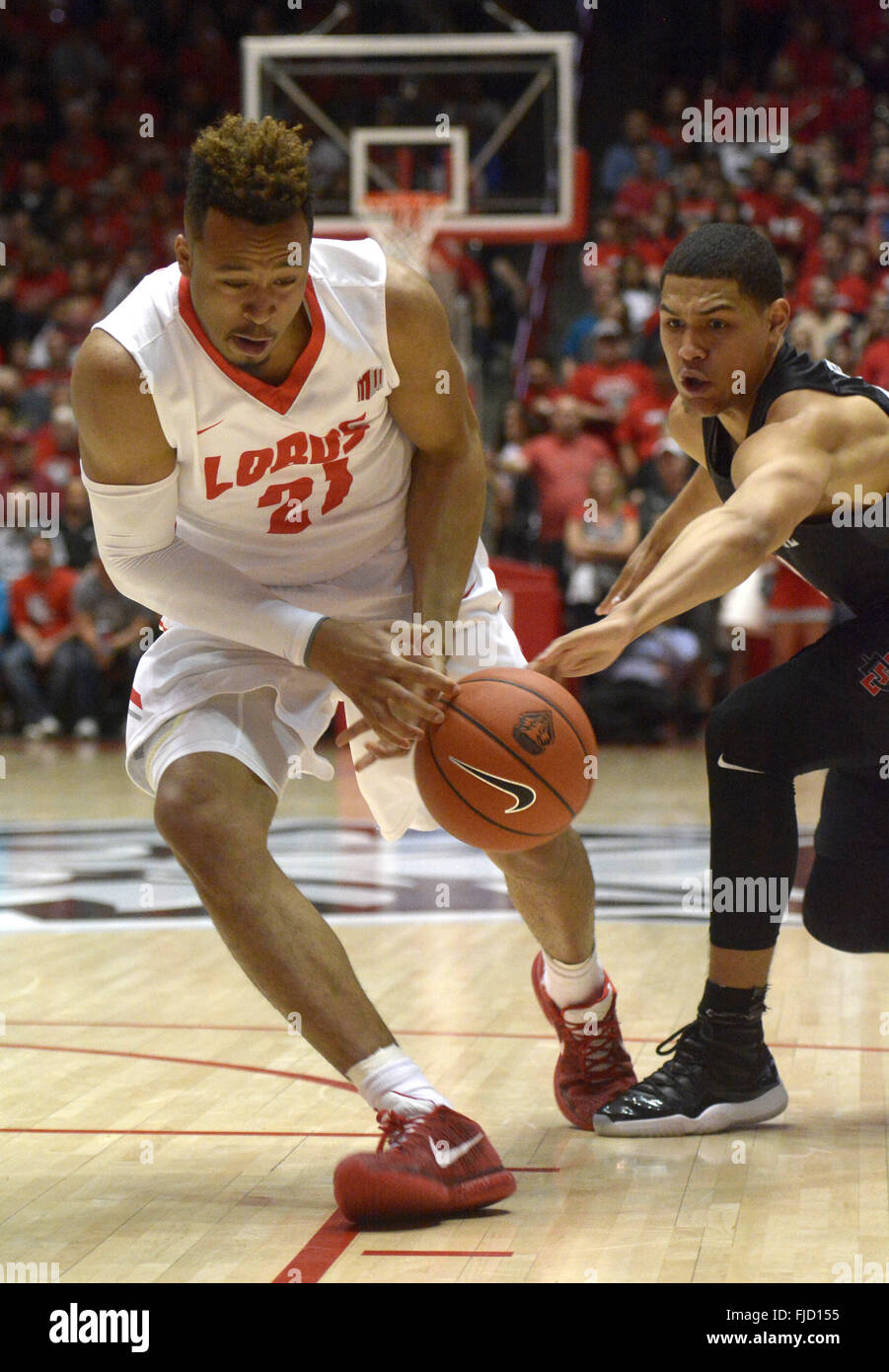 Usa. 1st Mar, 2016. SPORTS -- UNM's Xavier Adams, 21, has the ball ...