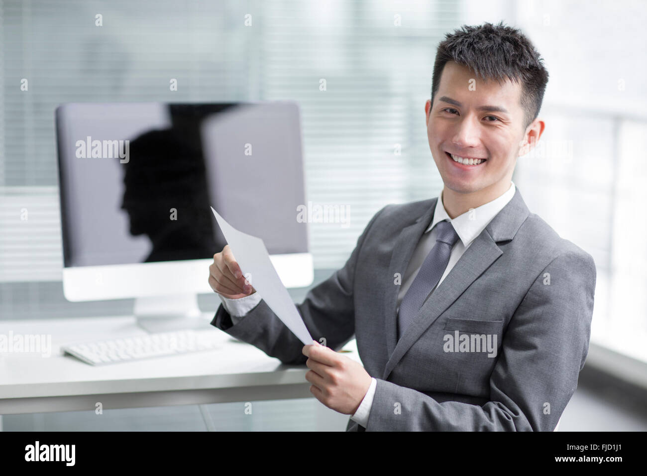 Chinese businessman working in office Stock Photo - Alamy