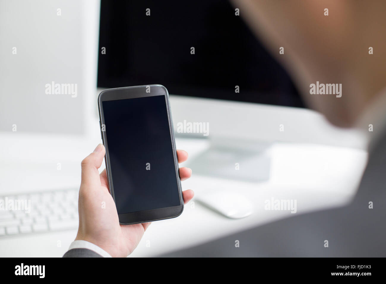 Chinese businessman using smart phone Stock Photo - Alamy