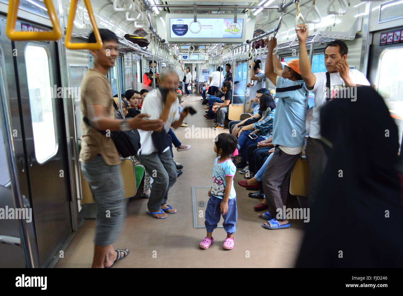 Passenger on commuter line jakarta in Jakarta Indonesia Stock Photo - Alamy