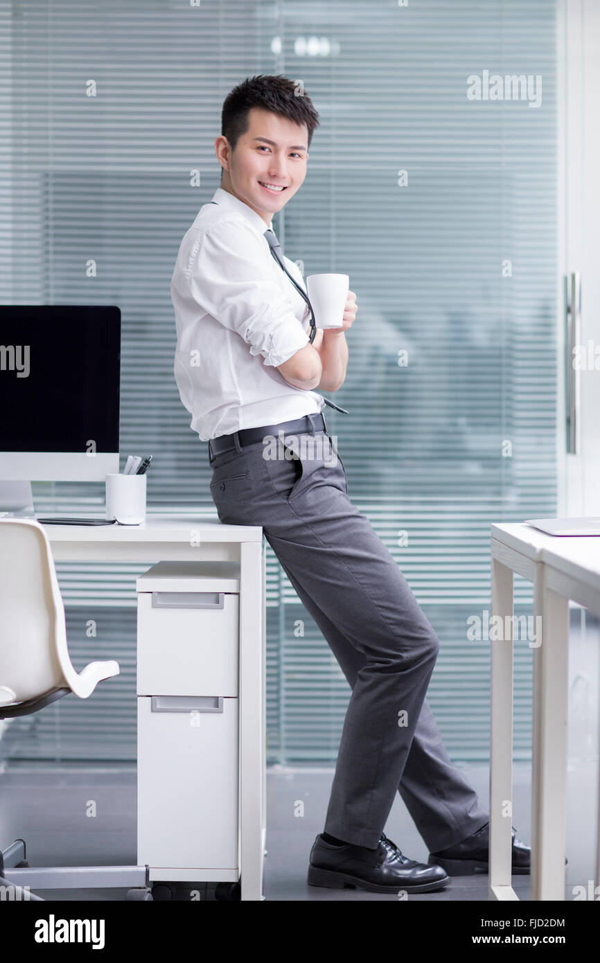 Chinese businessman taking a coffee break Stock Photo - Alamy