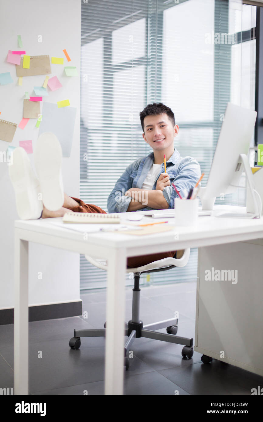 Young Chinese man in office Stock Photo - Alamy