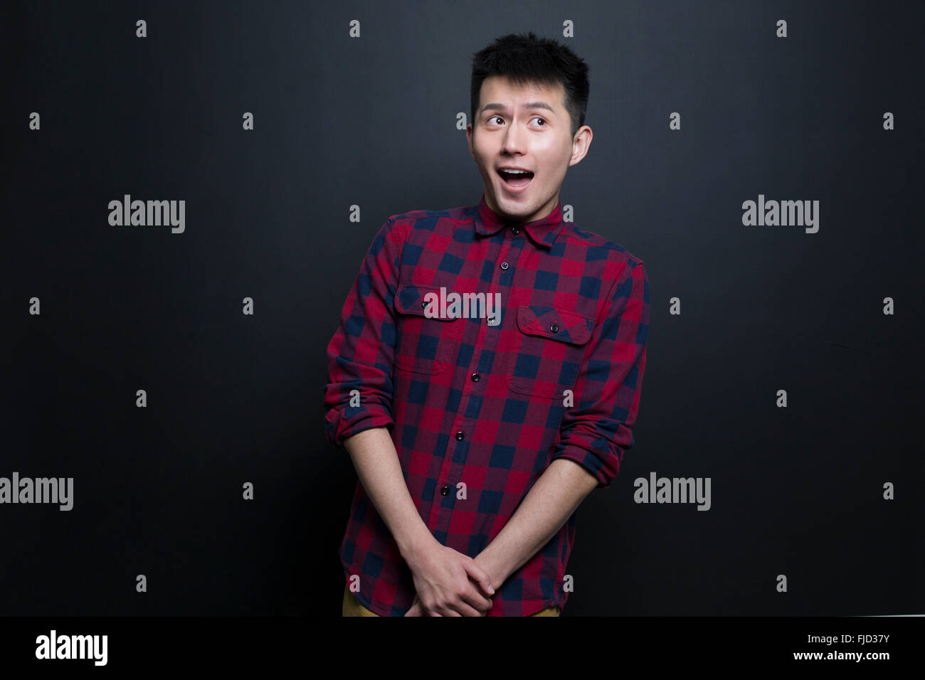 Young Chinese man eavesdropping Stock Photo - Alamy