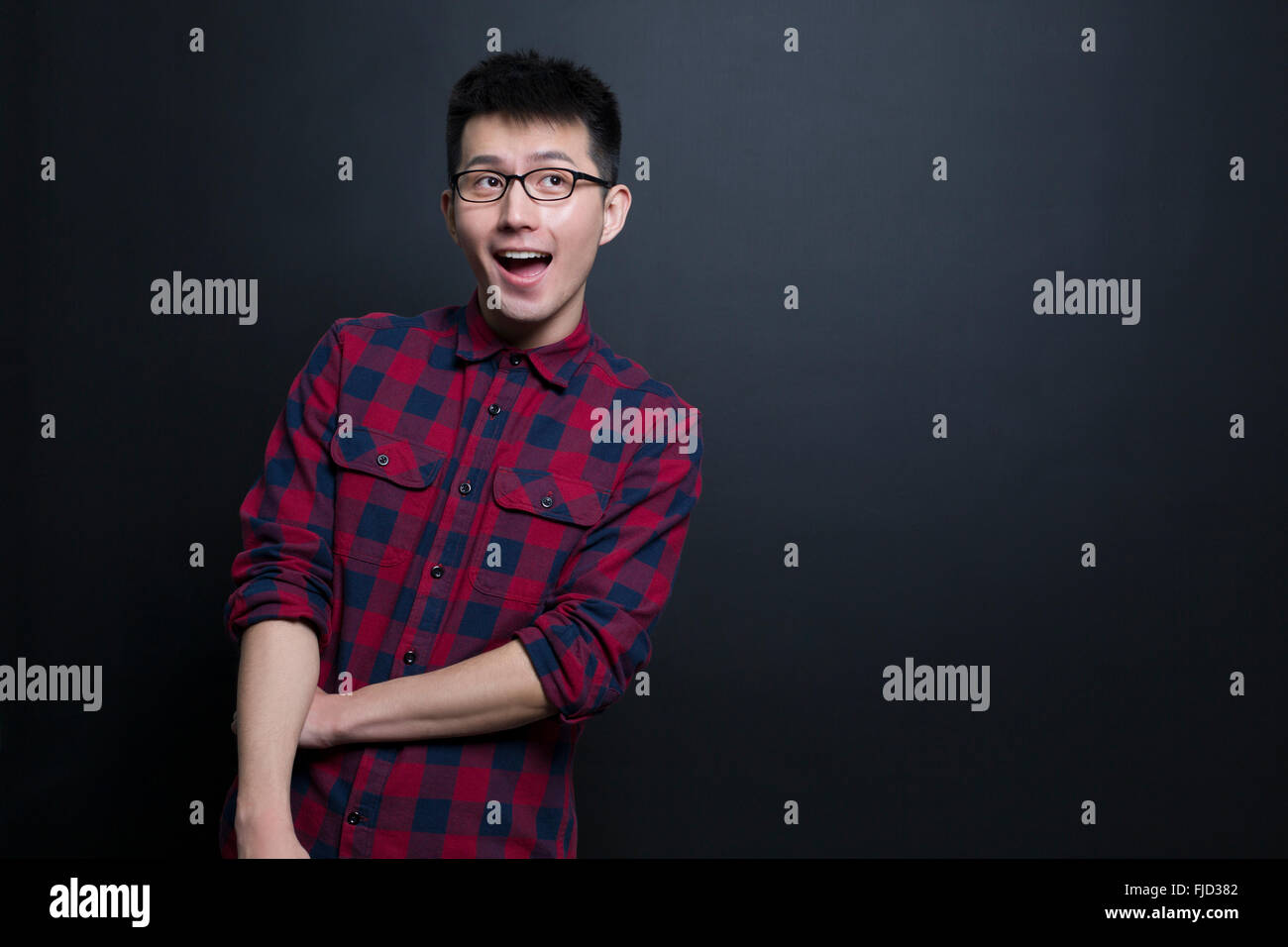 Young Chinese man eavesdropping Stock Photo - Alamy