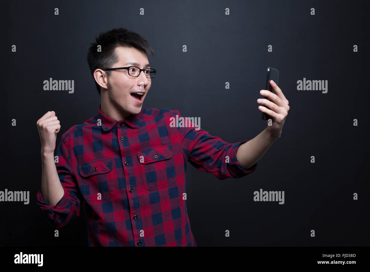 Excited chinese man hi-res stock photography and images - Alamy