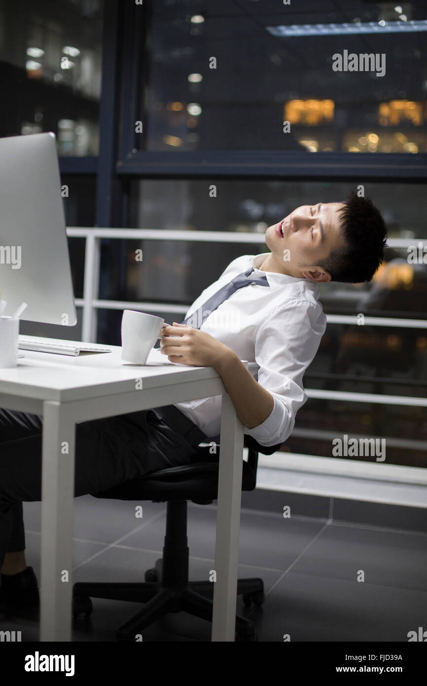 Businessman leaning over office chair hi-res stock photography and ...
