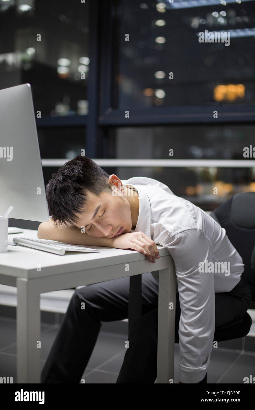 Tired businessman sleeping over hi-res stock photography and images - Alamy
